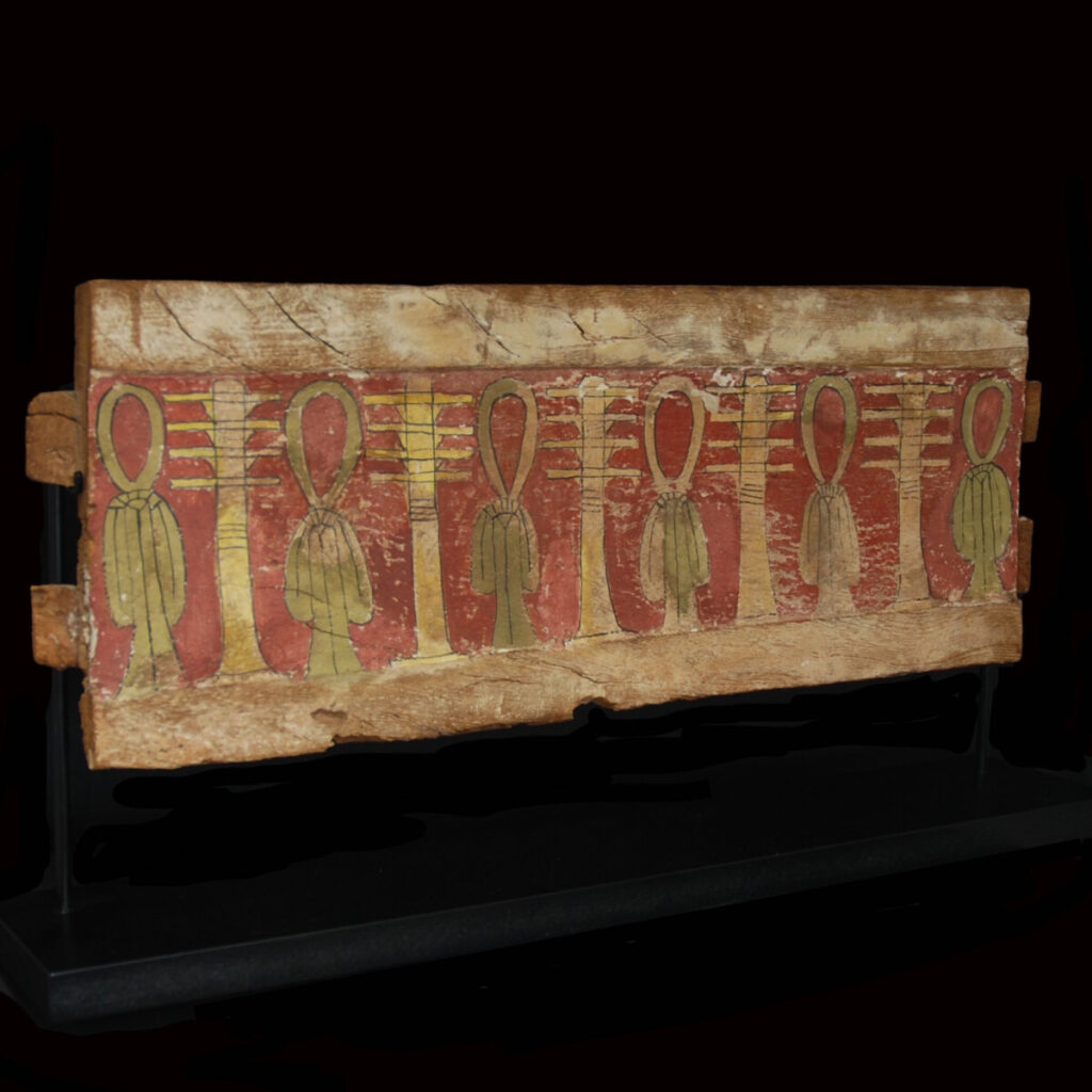 Large part of a wood sarcophagus with polychrome paint depicting ...
